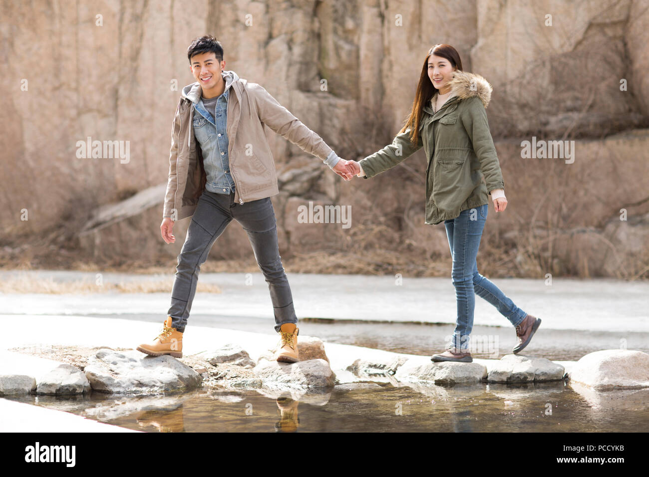 Happy young Chinese couple enjoying winter outing Stock Photo - Alamy