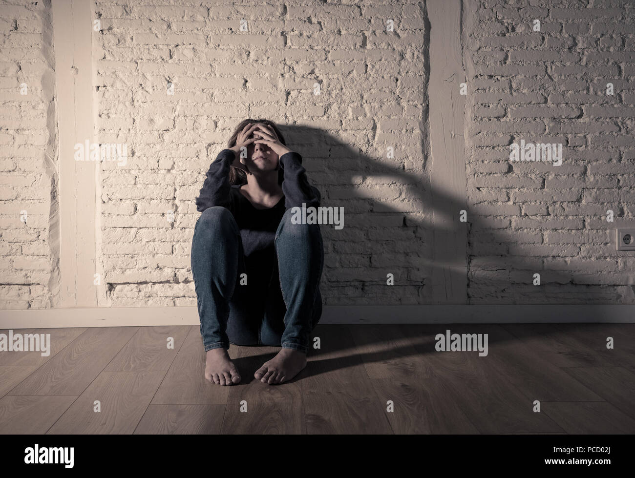 Young devastated depressed woman crying sad feeling hurt suffering ...