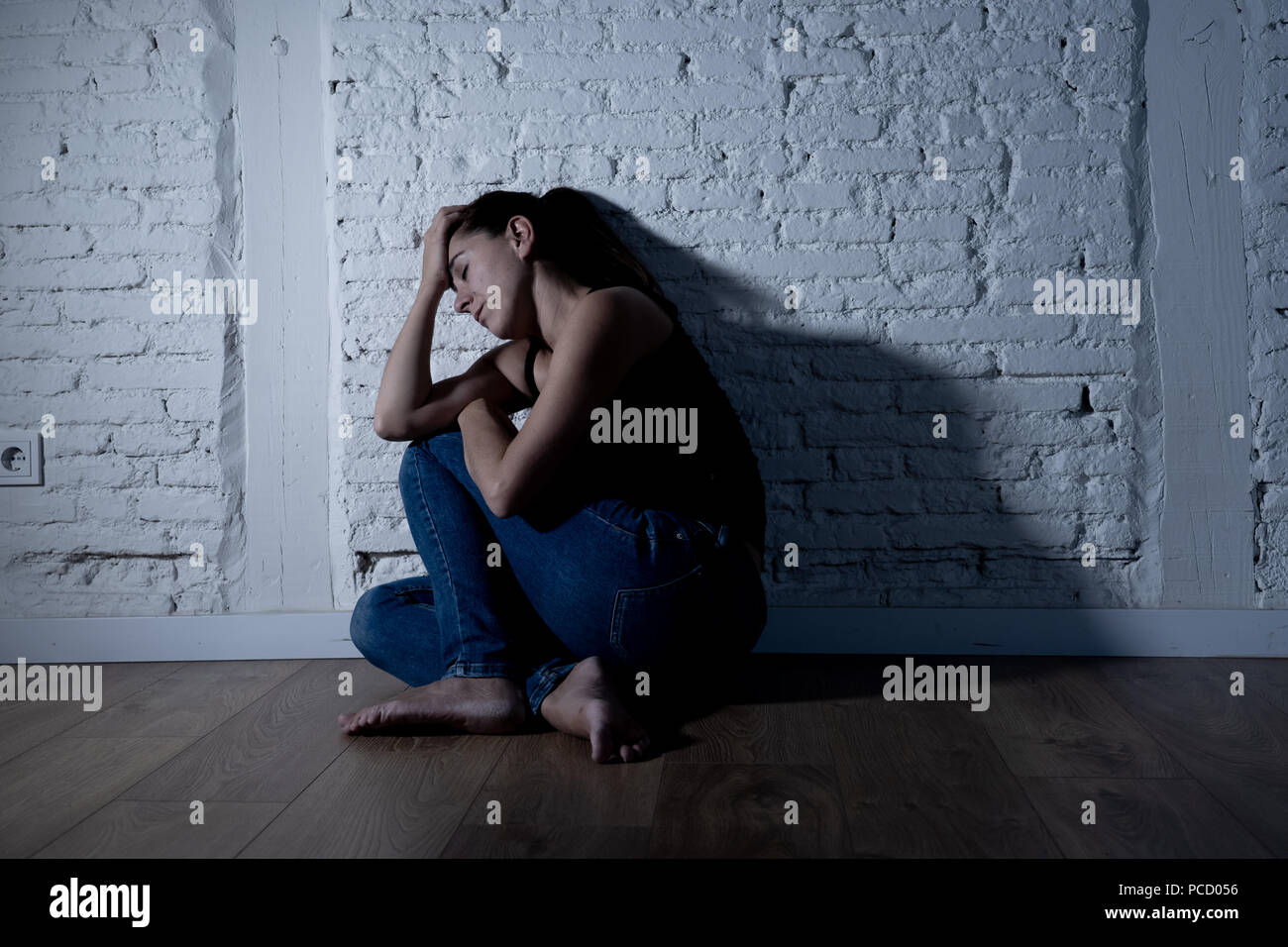 Young devastated depressed woman crying sad feeling hurt suffering ...