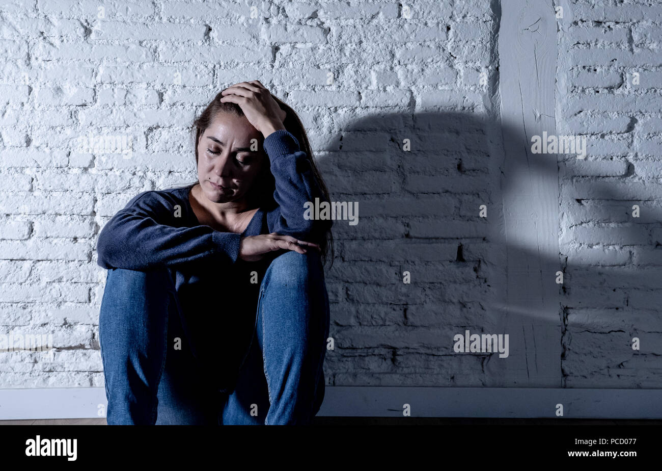 Young devastated depressed woman crying sad feeling hurt suffering ...