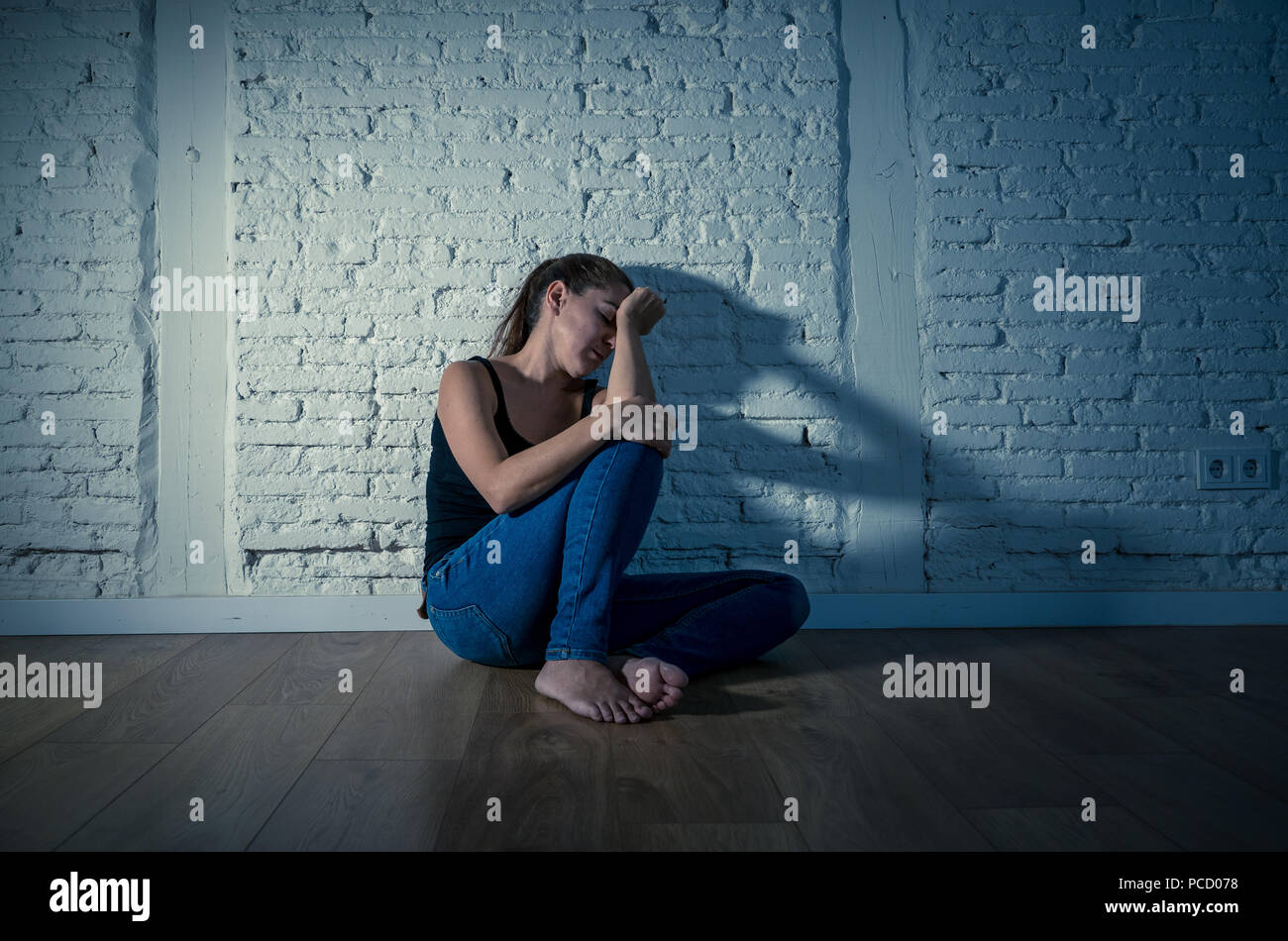 Young devastated depressed woman crying sad feeling hurt suffering ...