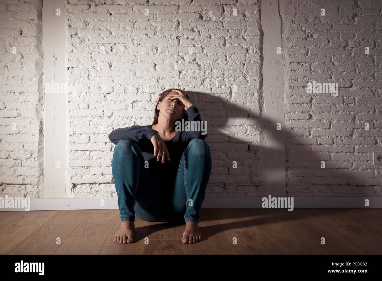 Young devastated depressed woman crying sad feeling hurt suffering ...