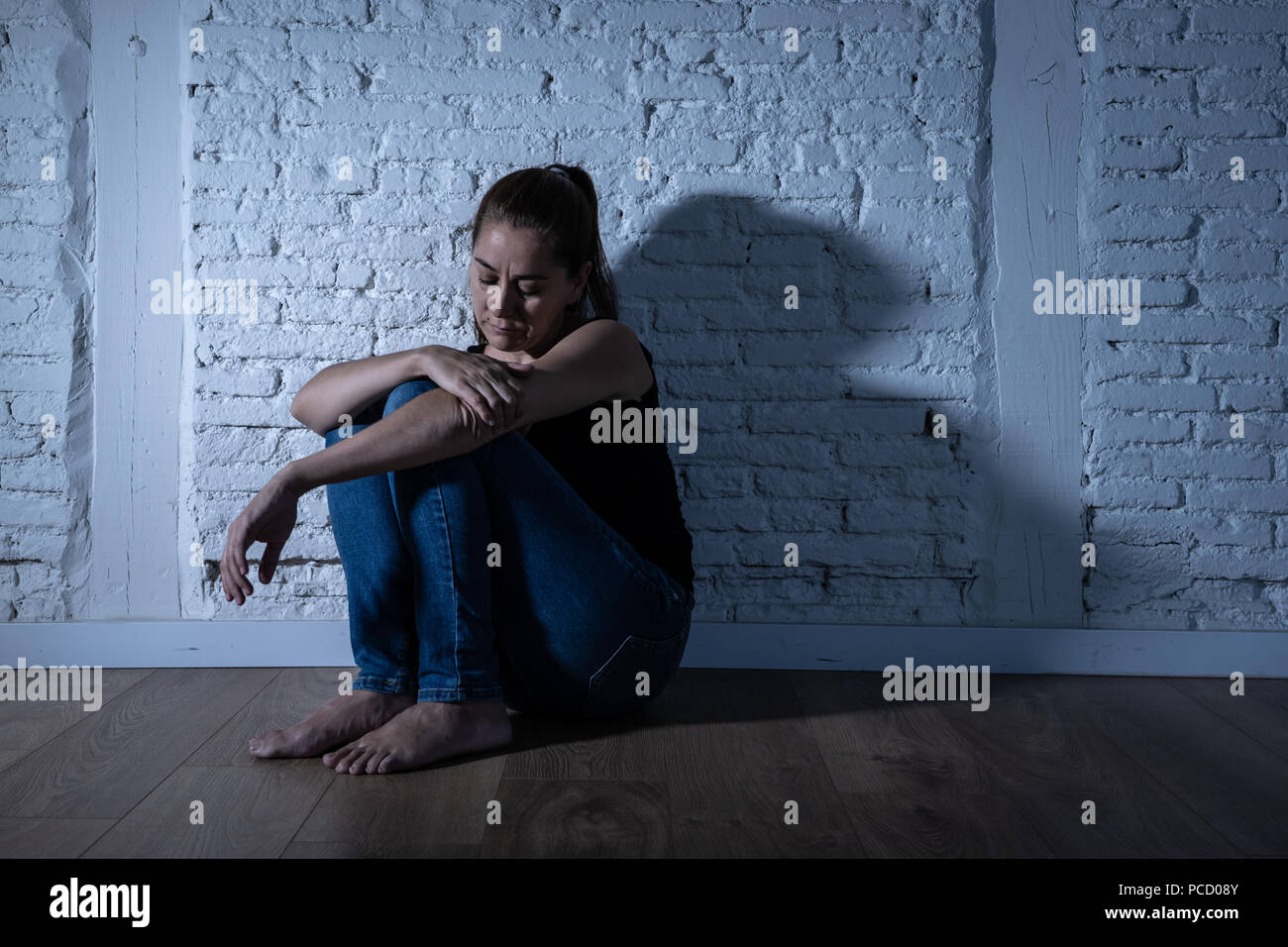 Young devastated depressed woman crying sad feeling hurt suffering ...