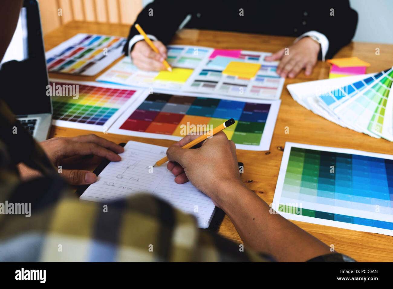 Graphic designers choose colors from the color bands samples for design ...