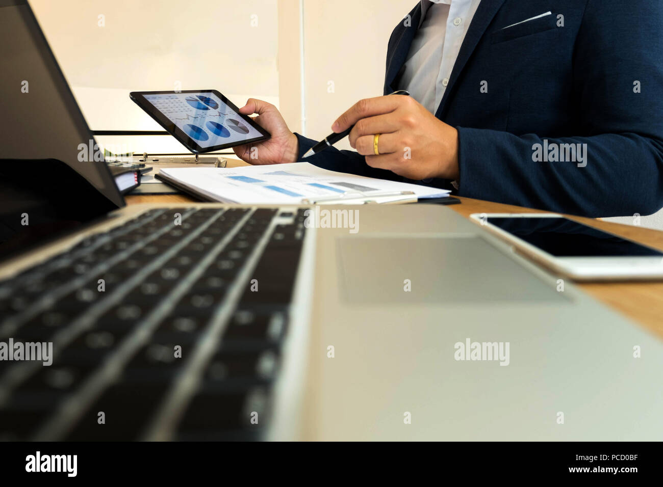 Business people using tablet to study data for business expansion ...