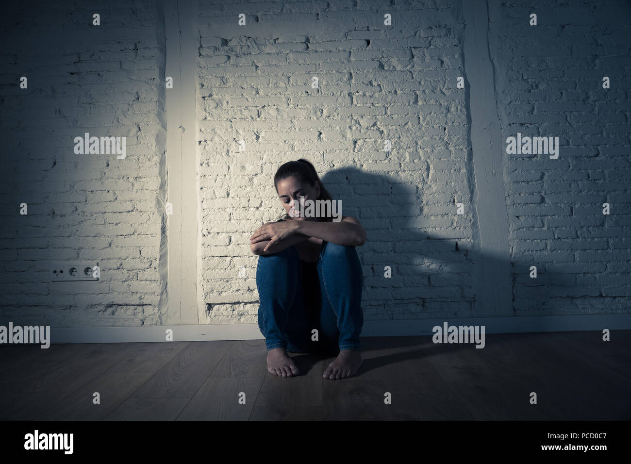 Young devastated depressed woman crying sad feeling hurt suffering ...