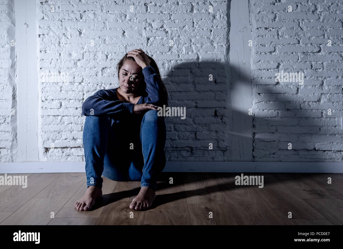 Young devastated depressed woman crying sad feeling hurt suffering ...