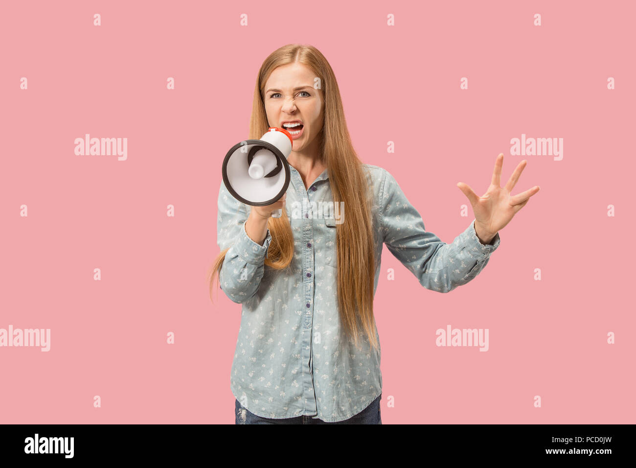 Woman making announcement with megaphone Stock Photo - Alamy