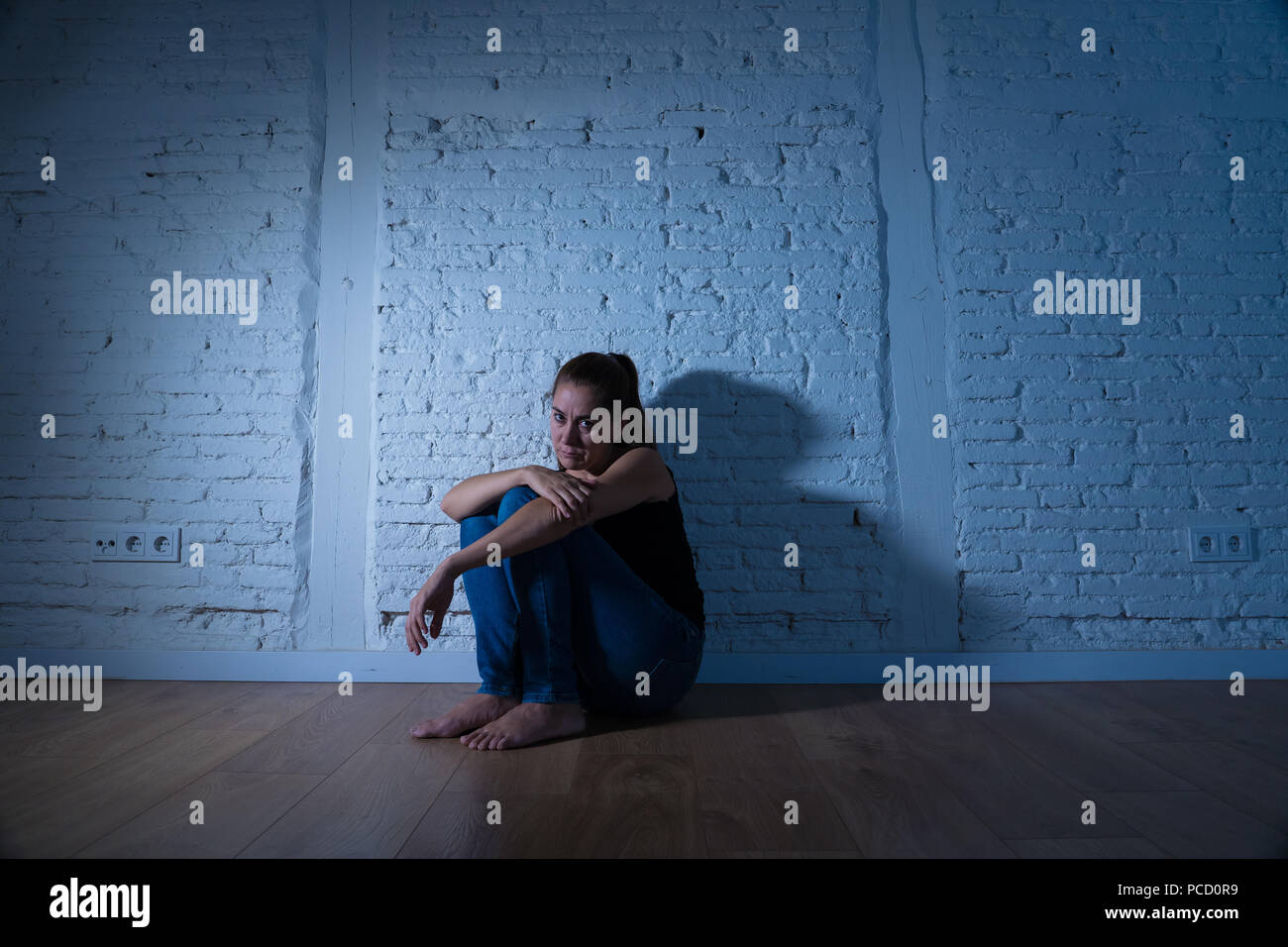 Young devastated depressed woman crying sad feeling hurt suffering ...