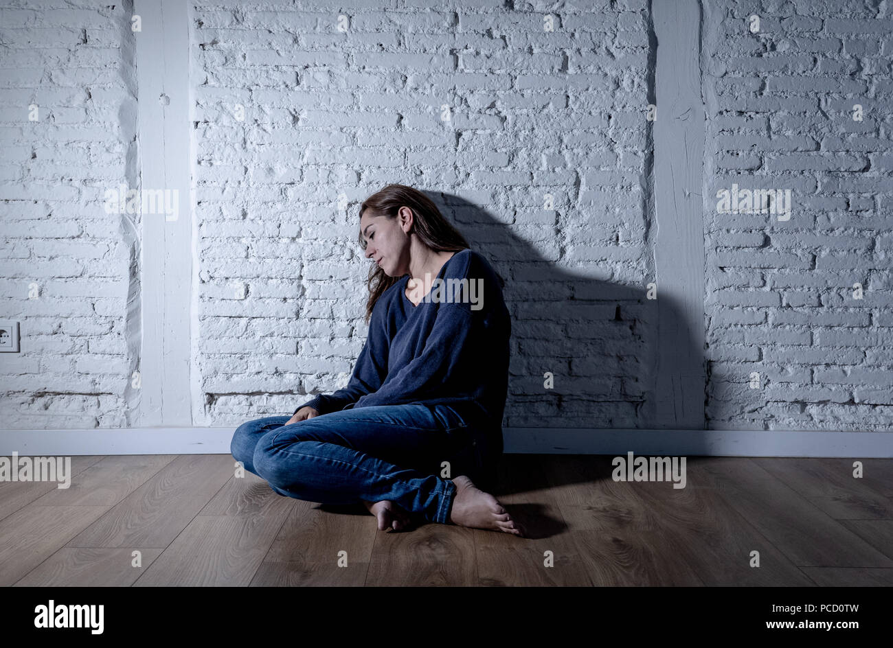 Young devastated depressed woman crying sad feeling hurt suffering ...