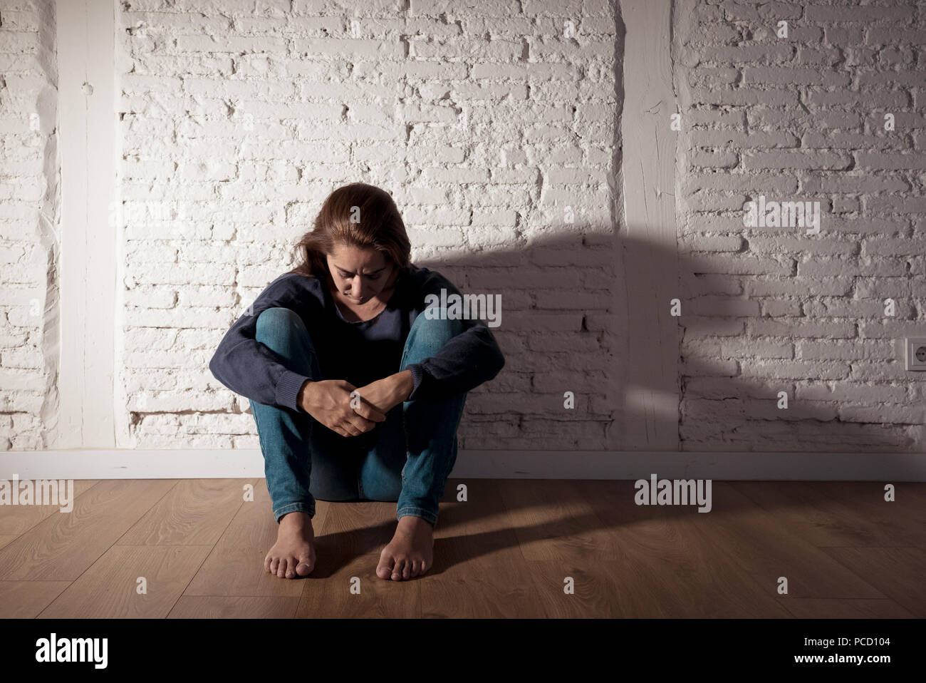 Young devastated depressed woman crying sad feeling hurt suffering ...