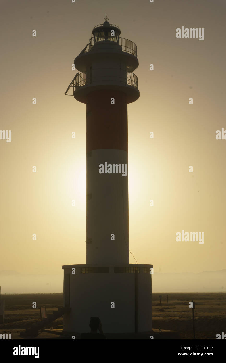 dawn in the desert with a lighthouse Stock Photo - Alamy