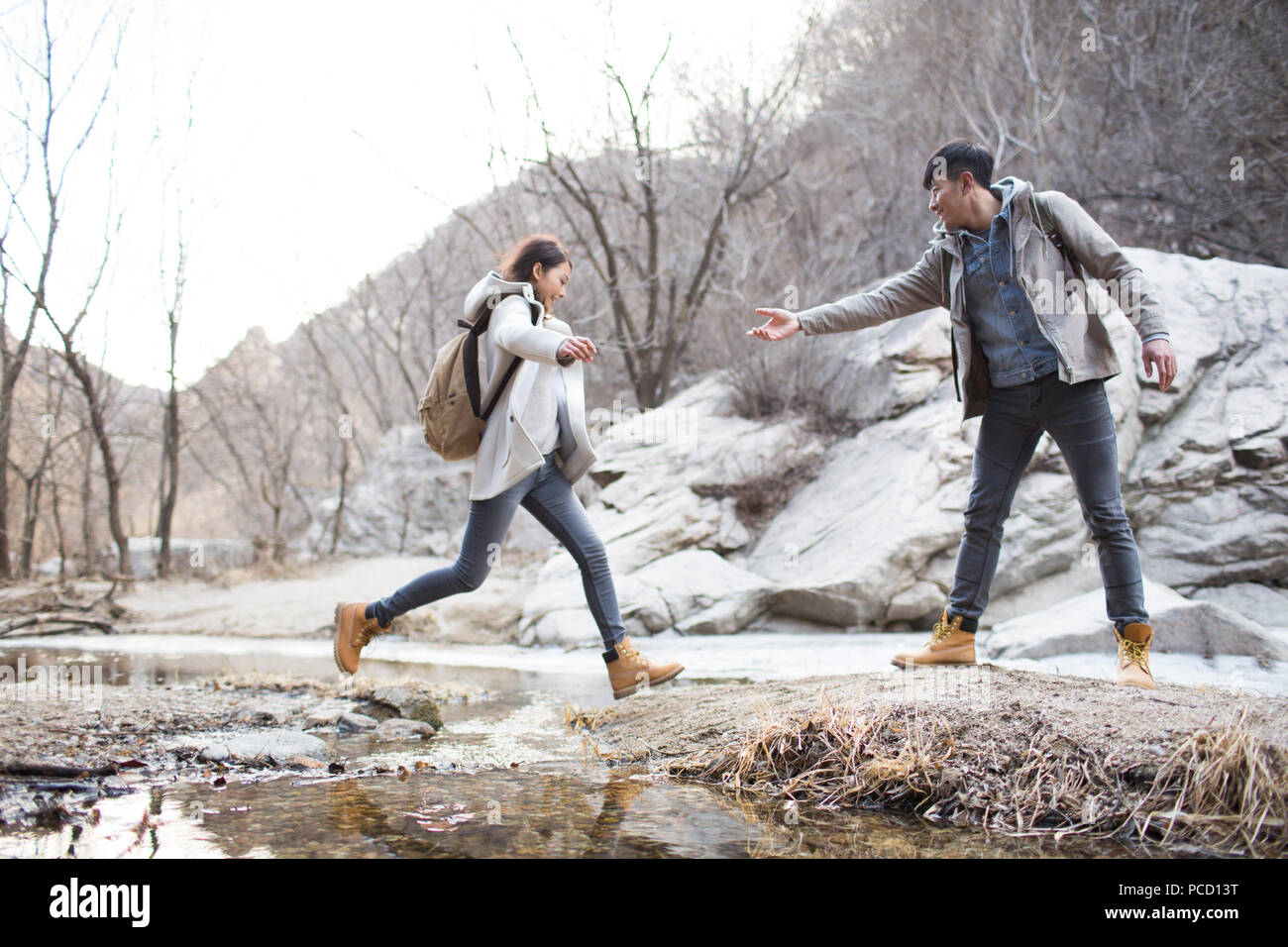 Happy young Chinese couple enjoying winter outing Stock Photo - Alamy