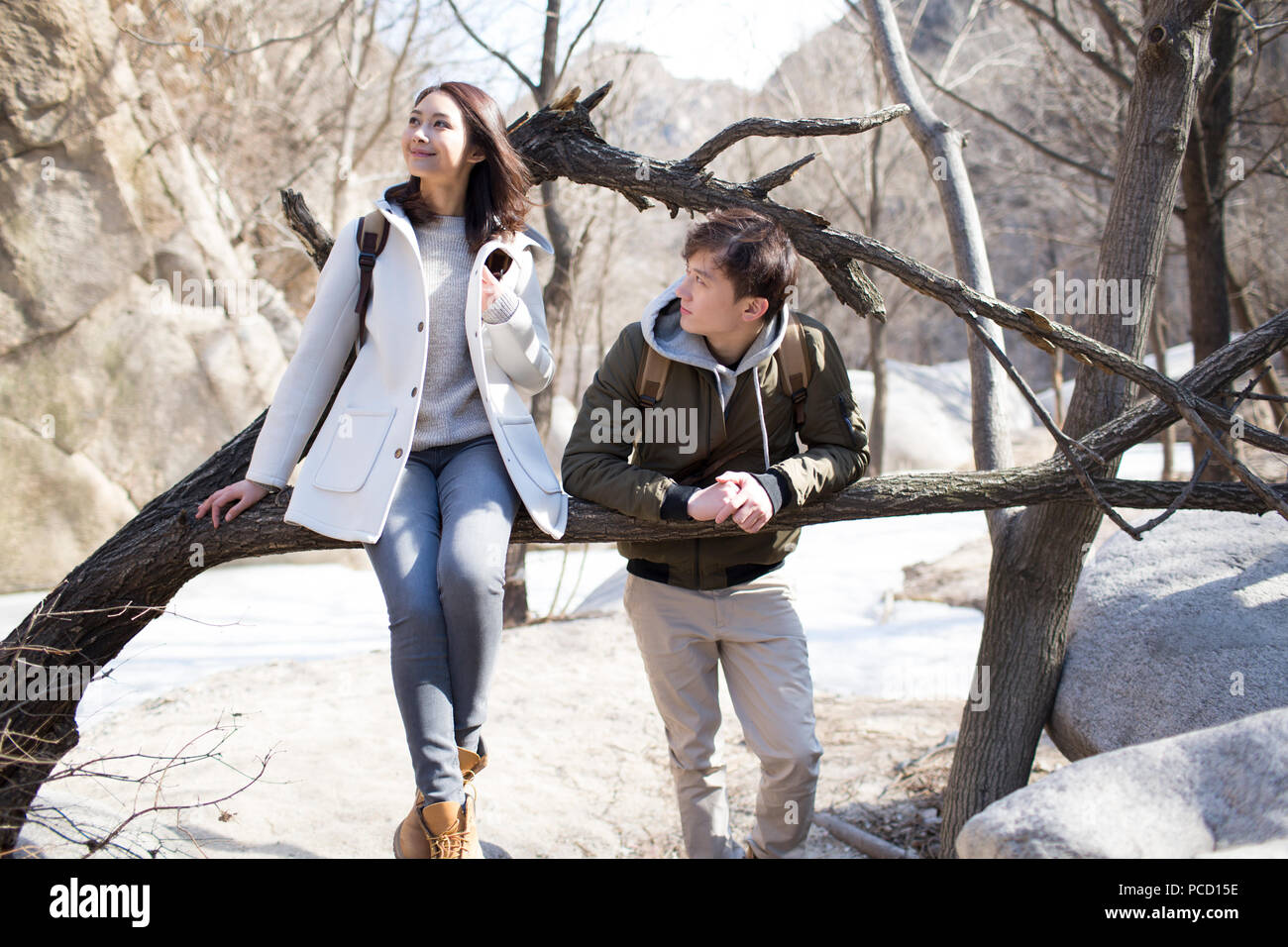 Happy young Chinese couple enjoying winter outing Stock Photo - Alamy