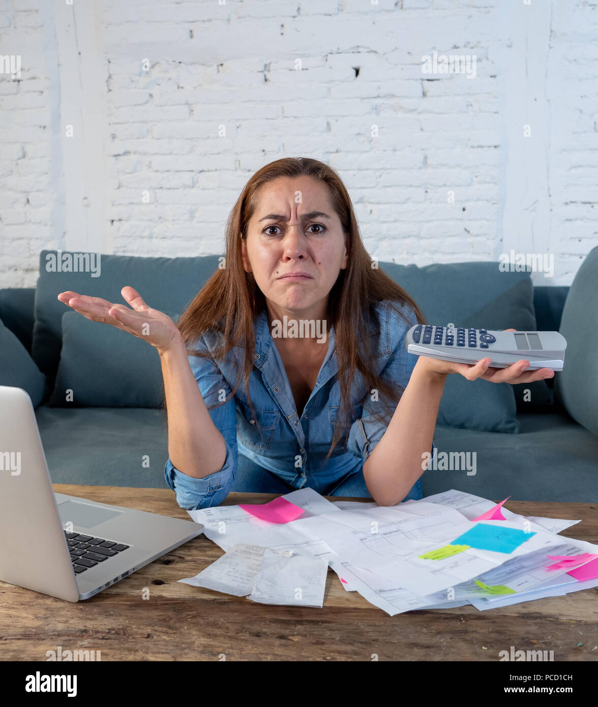 Woman worried bill in hand hi-res stock photography and images - Alamy