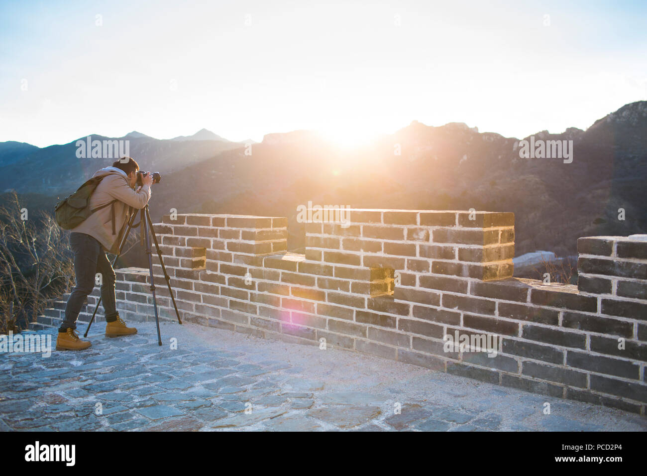 Young Chinese man photographing on the Great Wall Stock Photo - Alamy