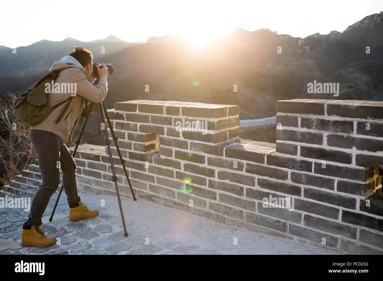 Young Chinese man photographing on the Great Wall Stock Photo - Alamy