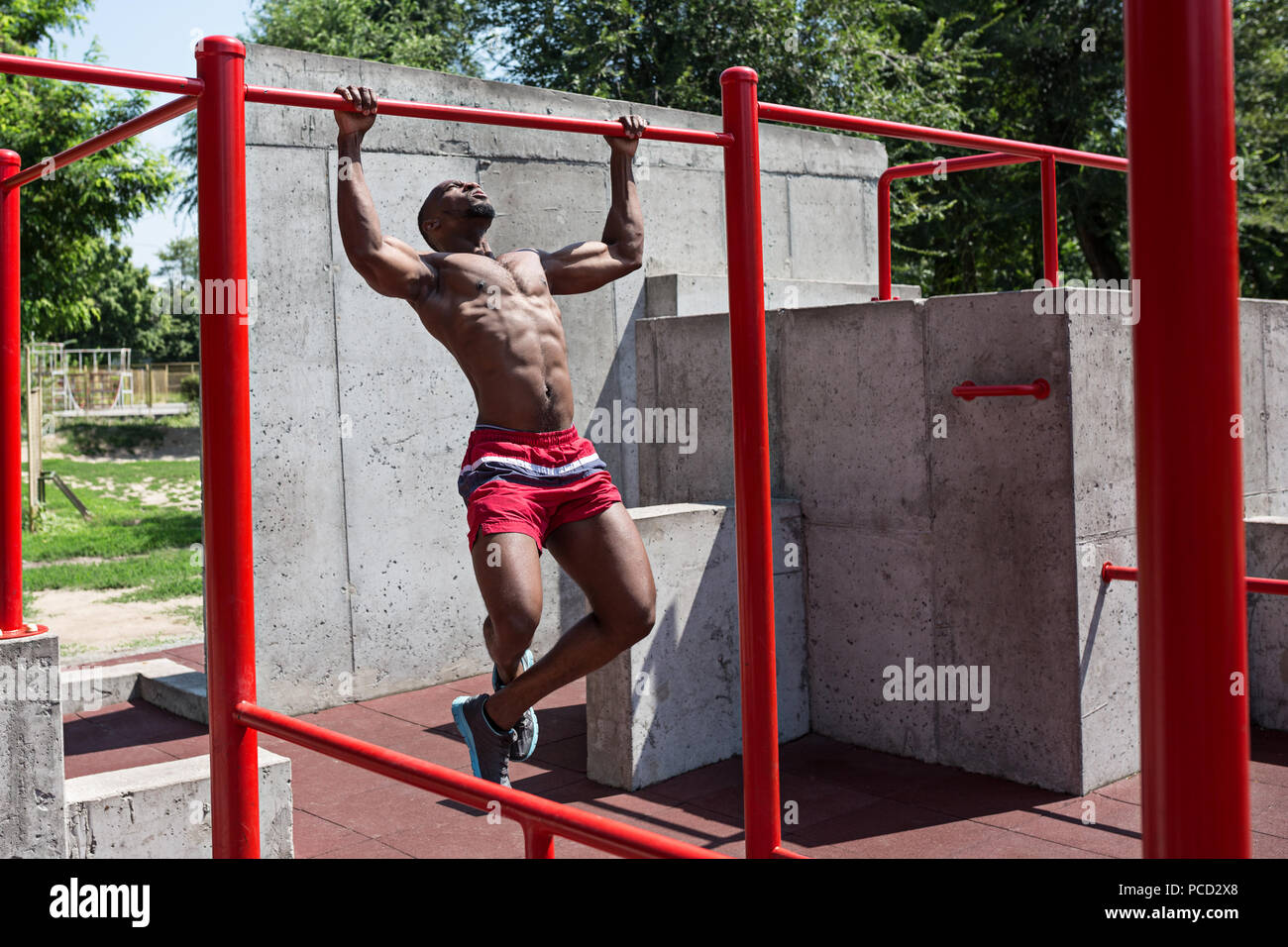 Athlete doing exercises at stadium Stock Photo - Alamy