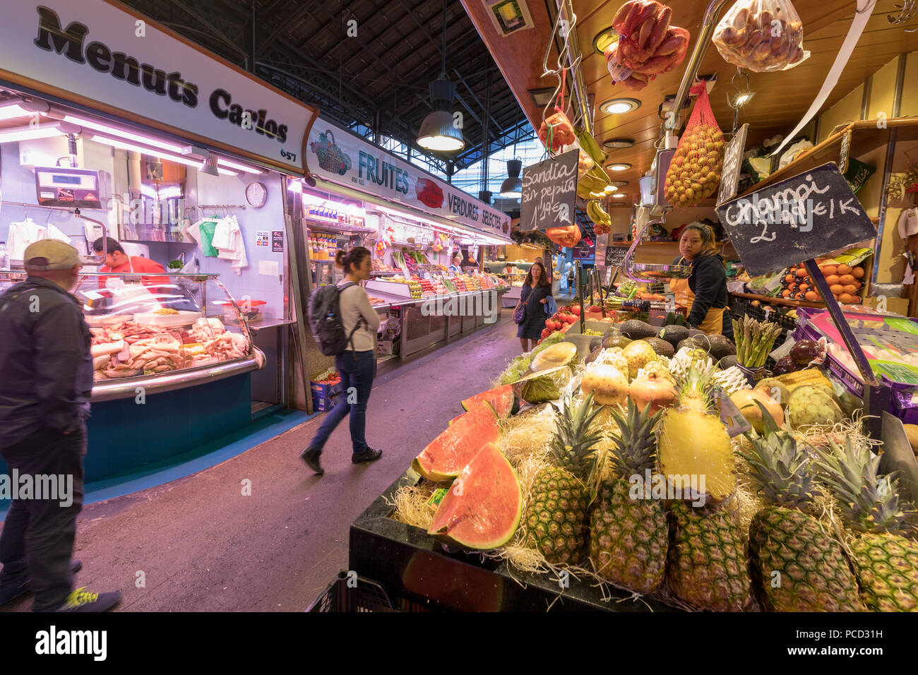 Stalls of food in the indoor La Boqueria Market, Ciudad Vieja ...