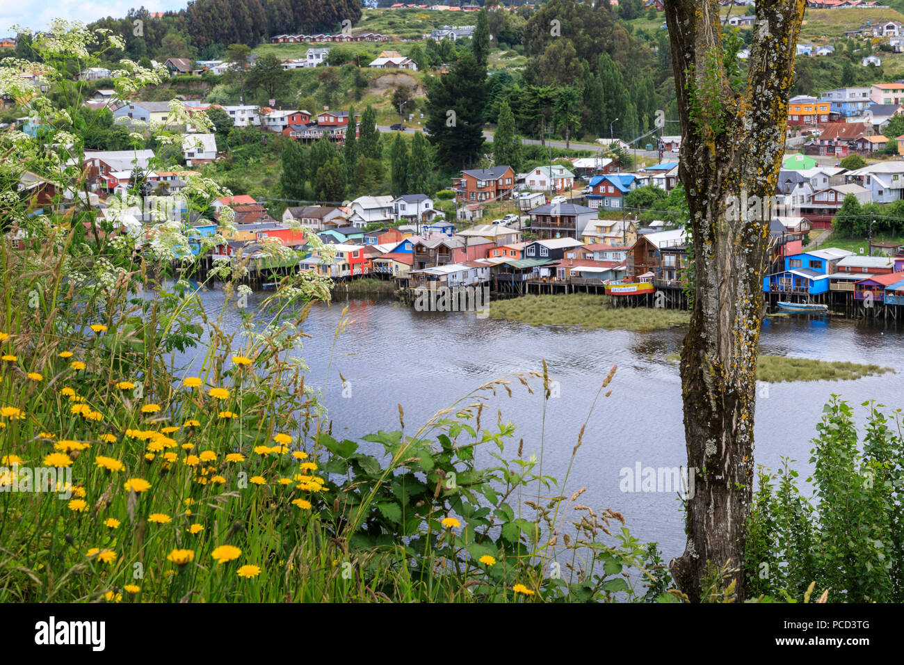 Palafitos, colourful stilt houses on water's edge, elevated view ...