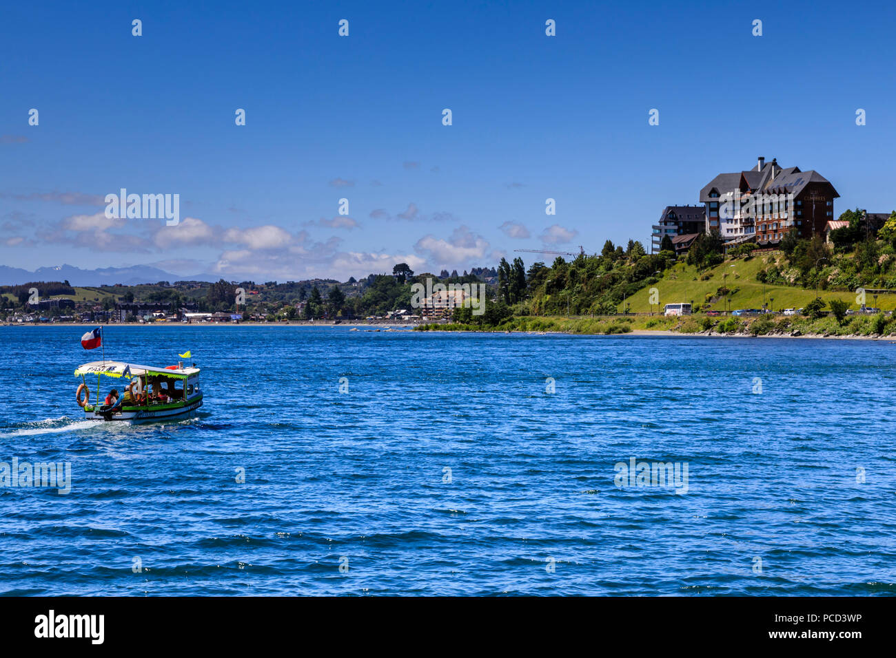 Excursion boat and wooded shoreline, Lake Llanquihue, downtown Puerto ...