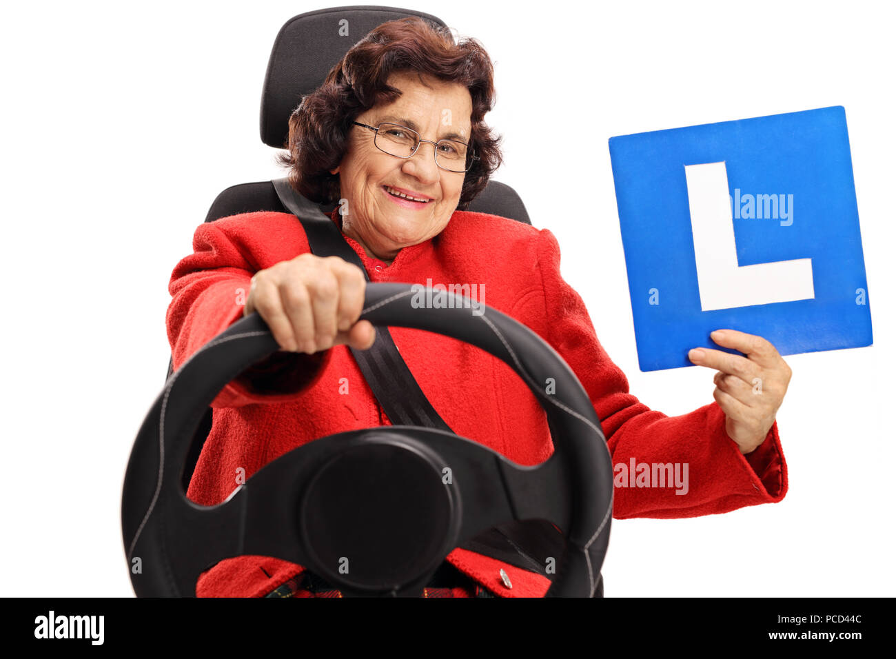 Mature woman driving and showing an L-sign isolated on white background ...