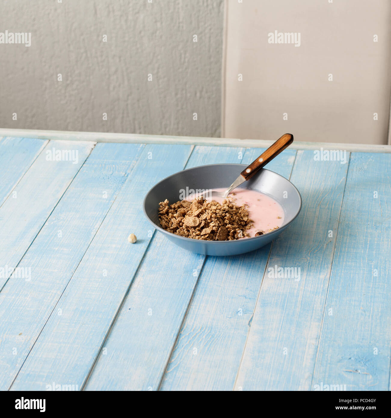 Plate of cereals with yogurt. Breakfast table concept Stock Photo - Alamy