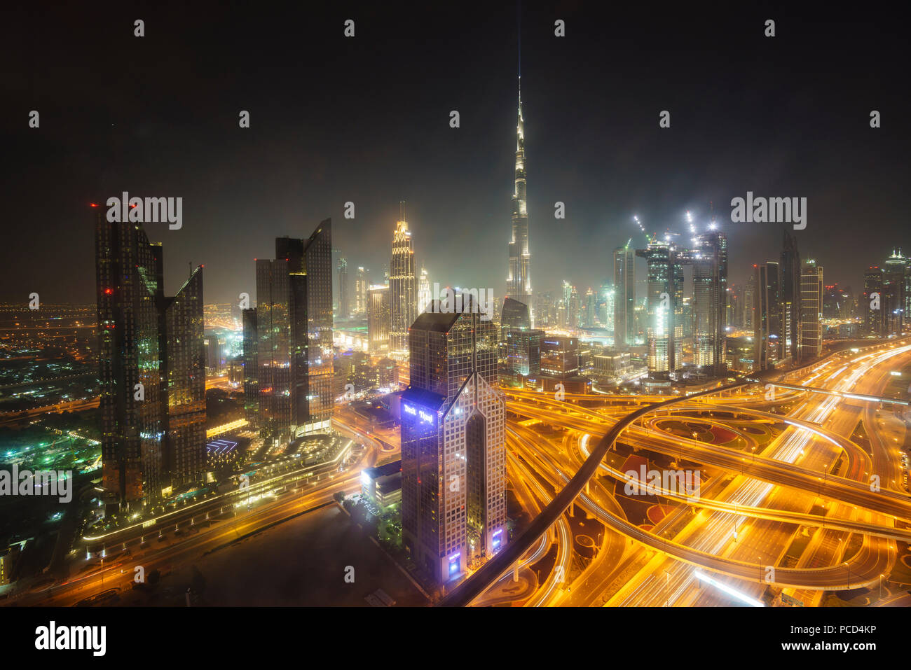 Dubai skyline and Sheikh Zayed Road Interchange by night, Dubai, United ...