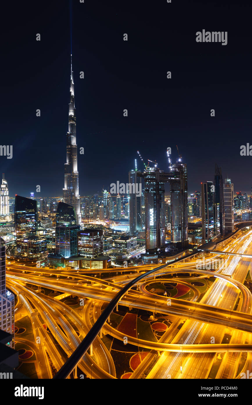 Dubai skyline and Sheikh Zayed Road Interchange by night, Dubai, United ...