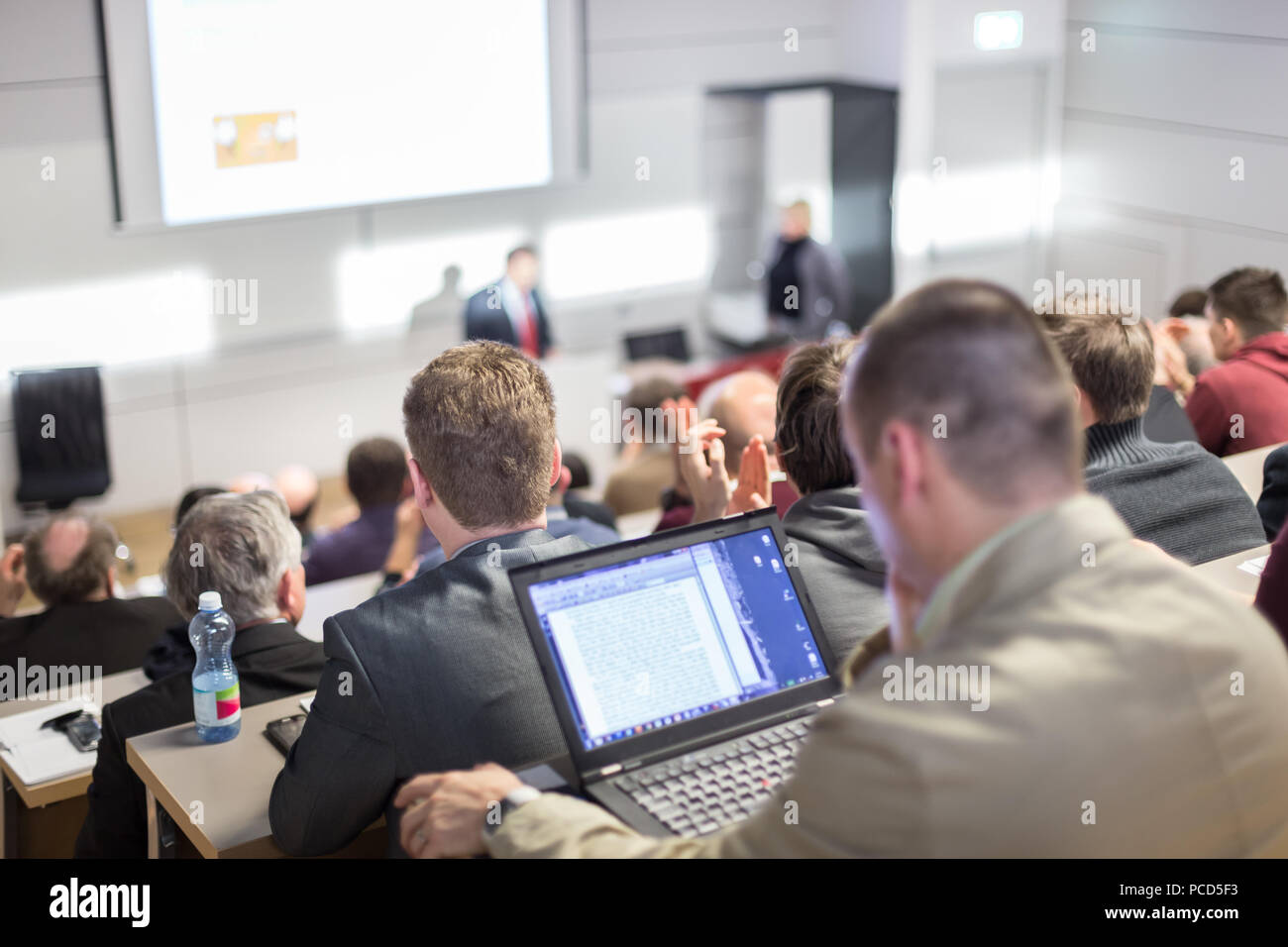 Business speaker giving a talk at business conference event Stock Photo ...