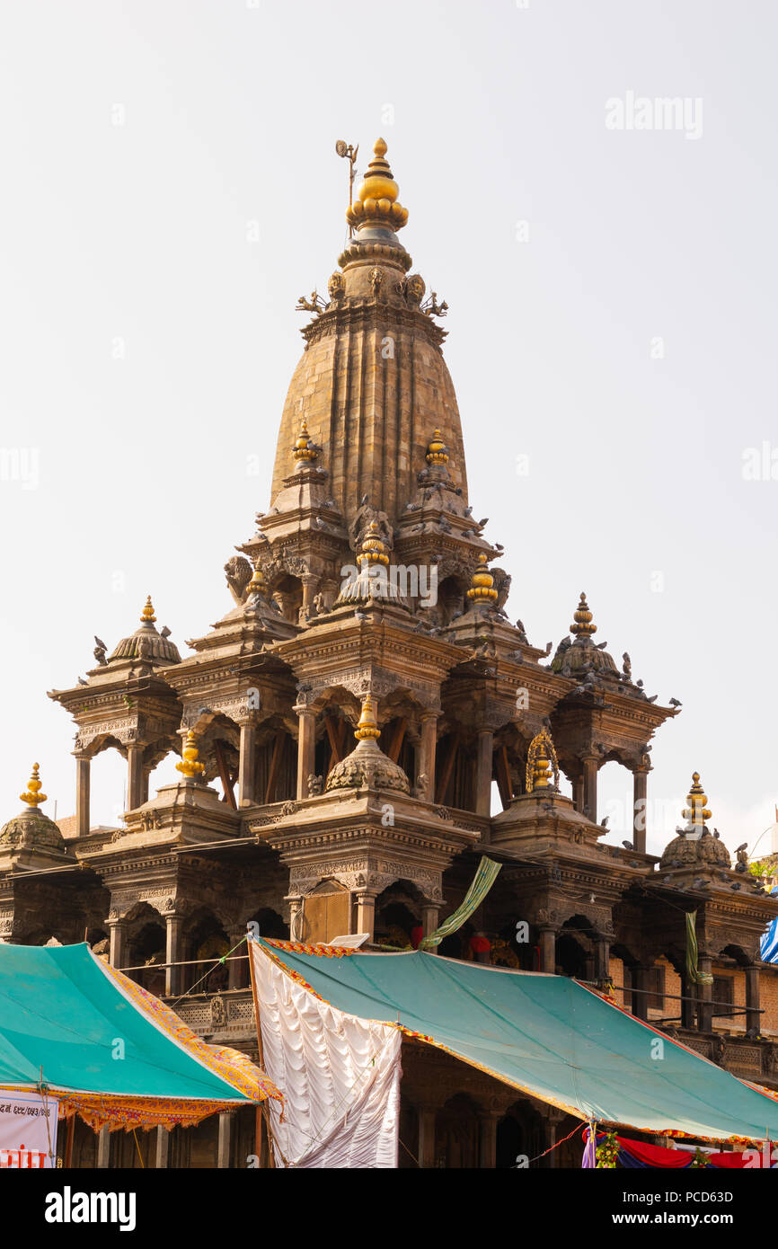 Prayer flags and decorations are held over Patan Durbar Square in ...