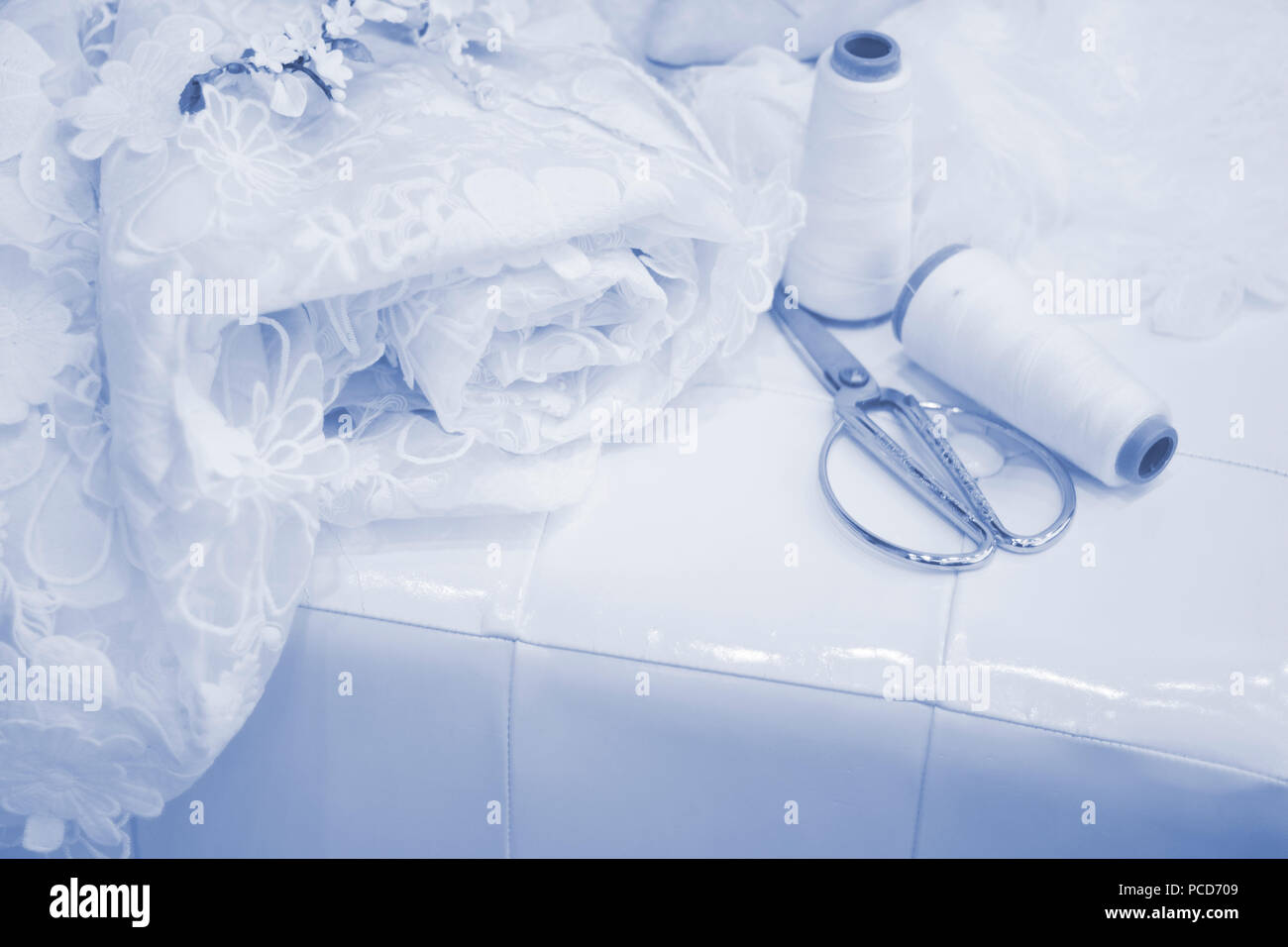 Bridal store hand made dress shop window with scissors, thread and ...