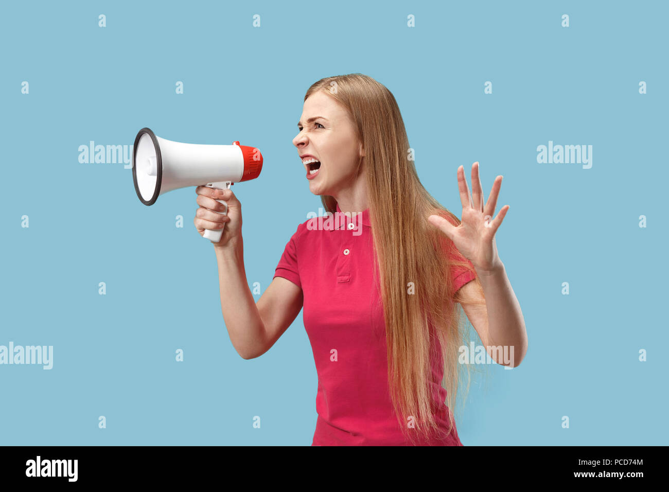 Woman making announcement with megaphone Stock Photo - Alamy