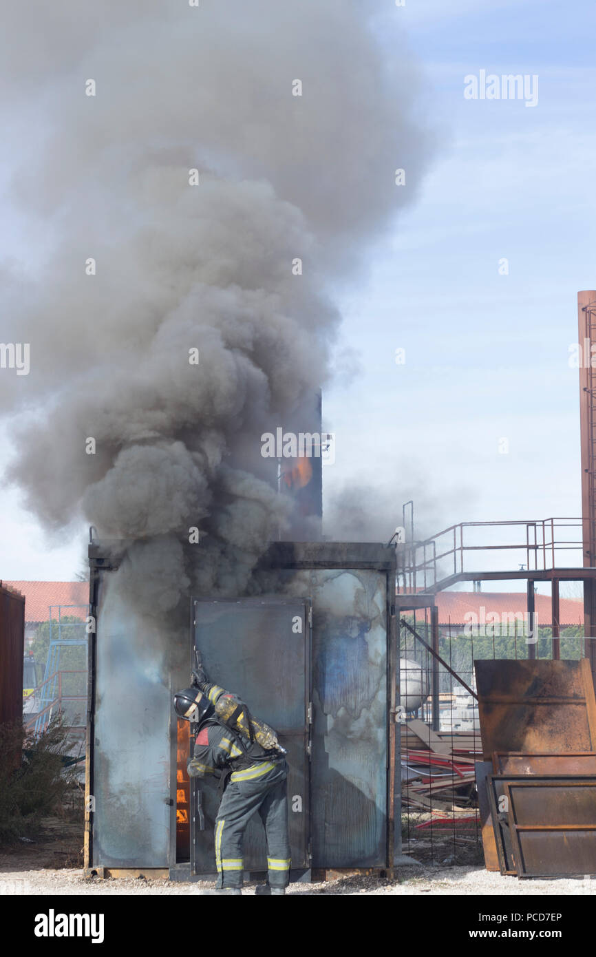 Firefighter putting out fire training station extinguisher backdraft ...