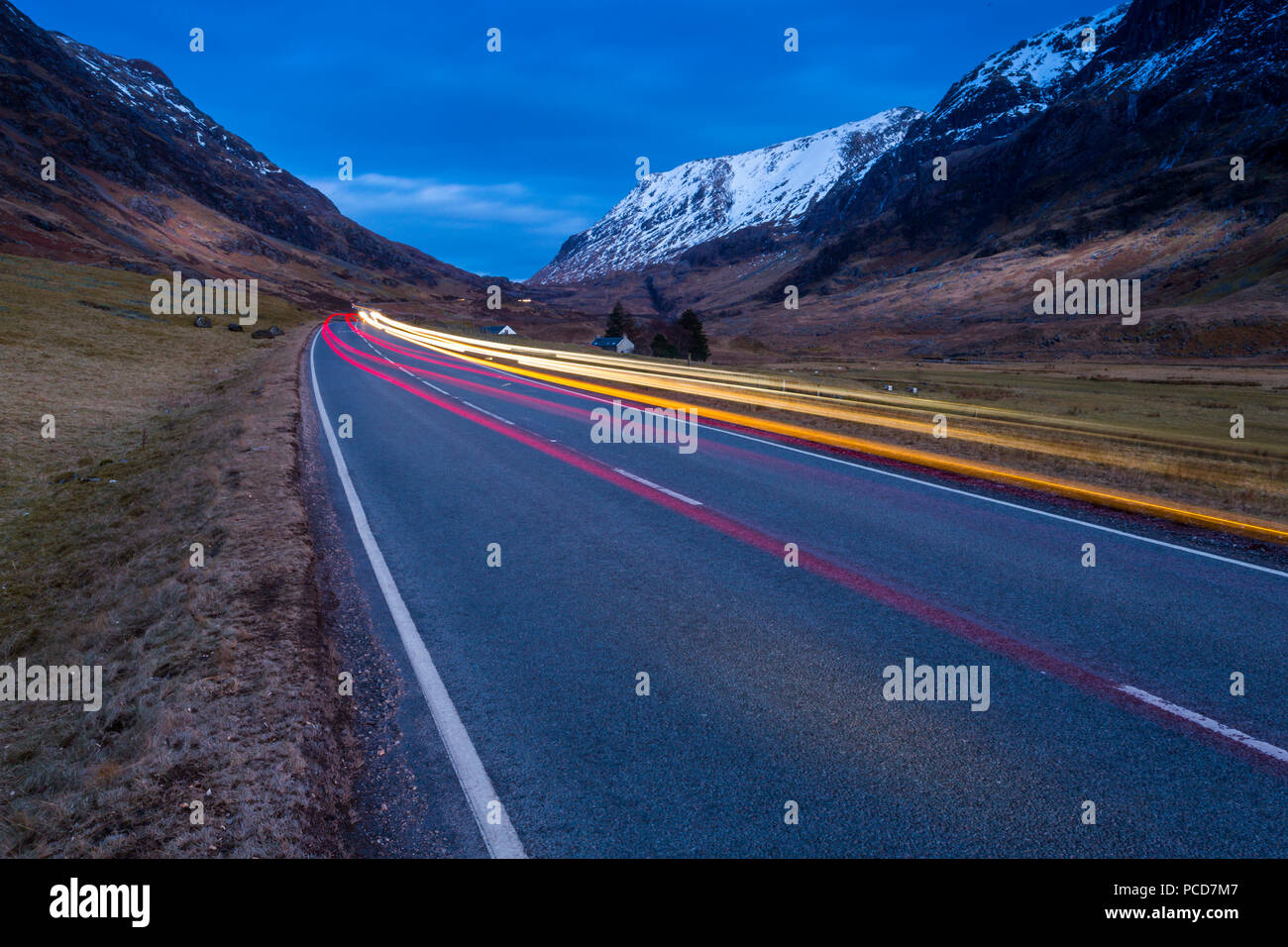 View of road through the Glencoe Valley at dusk, Glencoe, Highland ...