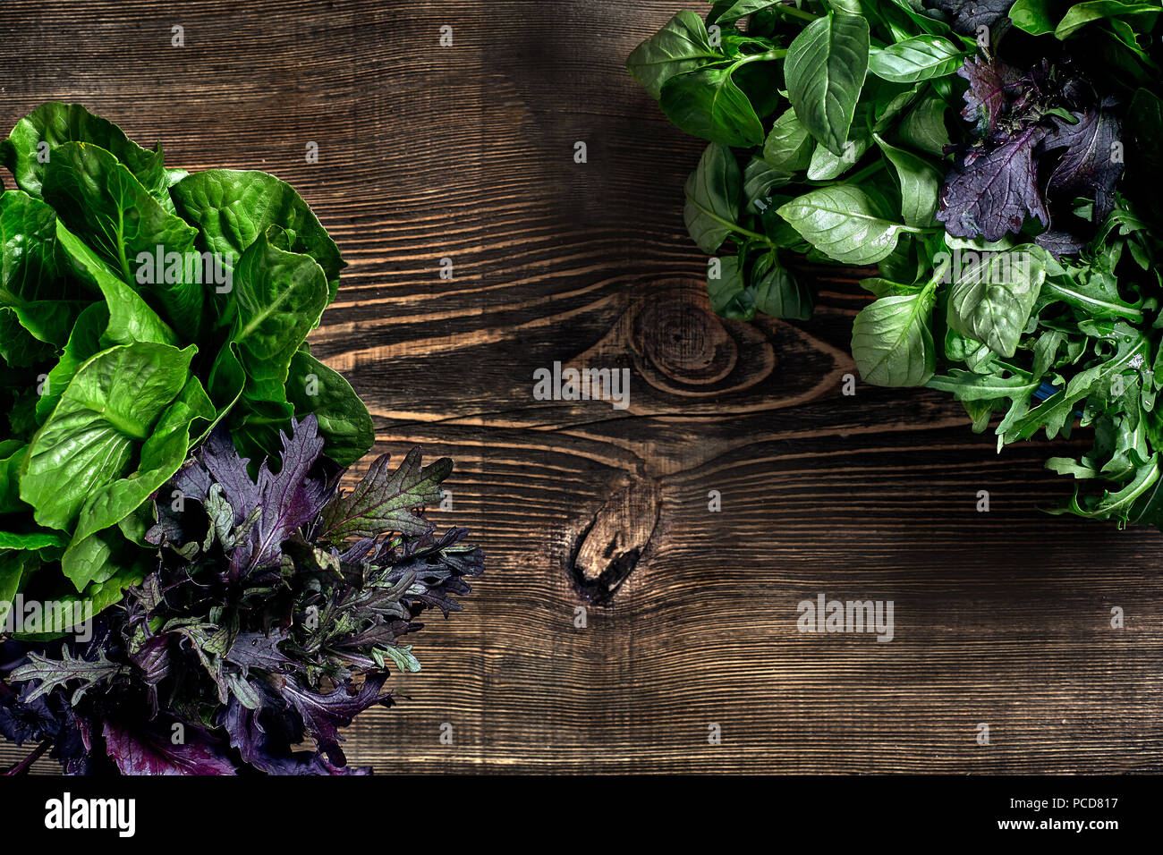 Variety of fresh organic herbs on wooden background. Freshly harvested ...