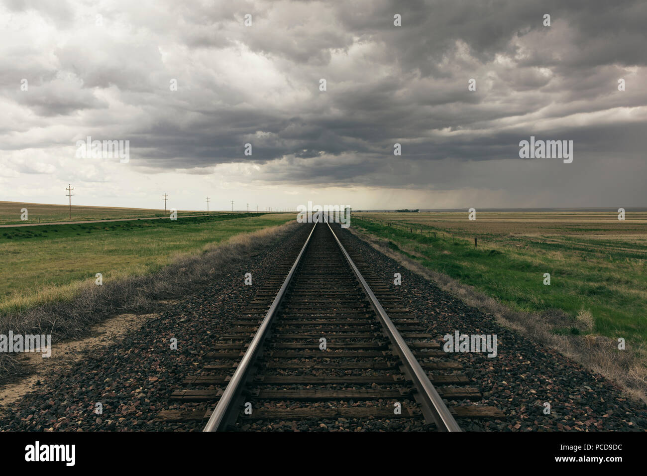 Railroad tracks storm clouds in hi-res stock photography and images - Alamy