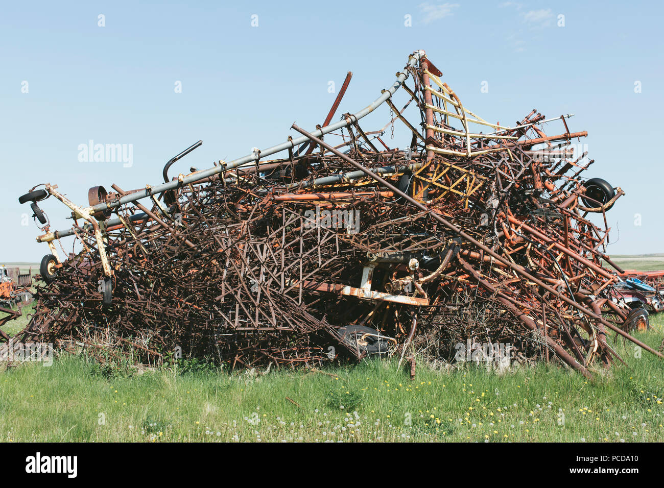 Pile of discarded farming equipment in rural landfill, near Kildeer ...
