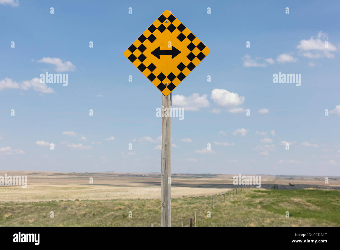 Arrow intersection sign and rural farmland Stock Photo - Alamy