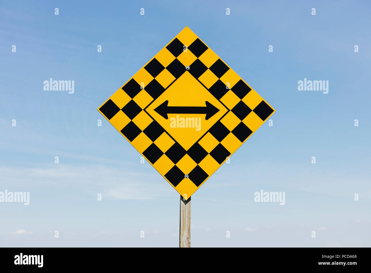 Arrow intersection sign Stock Photo - Alamy