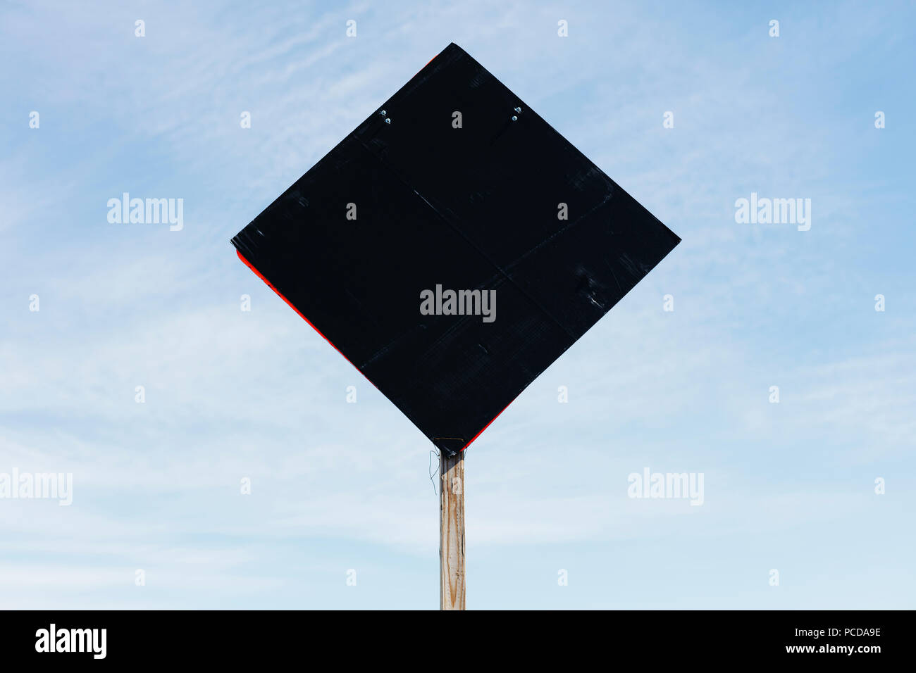 Back side of road sign, blue sky in background Stock Photo - Alamy