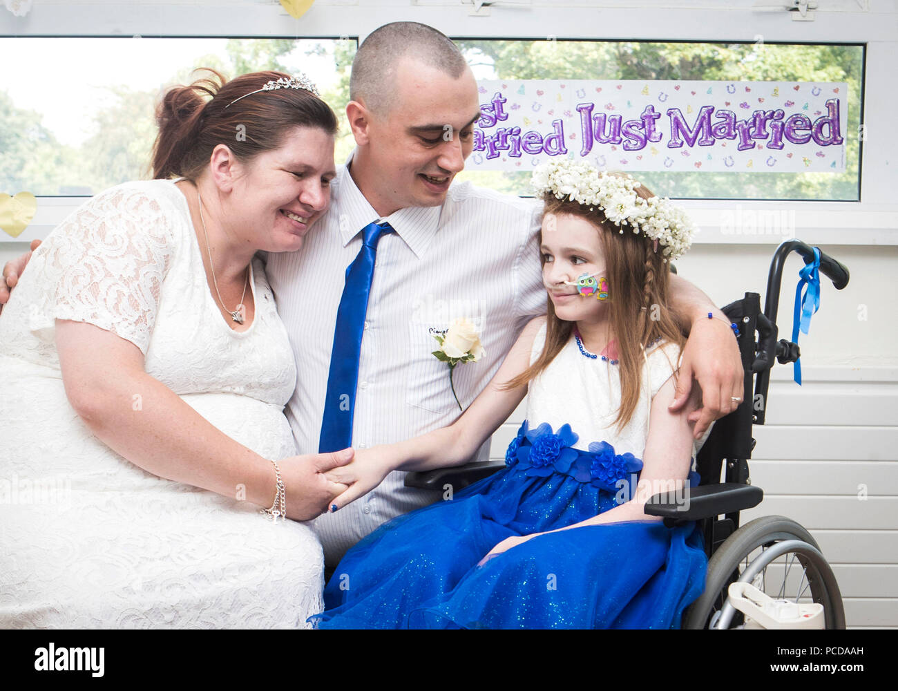 Cancer patient Kayleigh Walsh (right) with her parents Lyndsey and Paul ...
