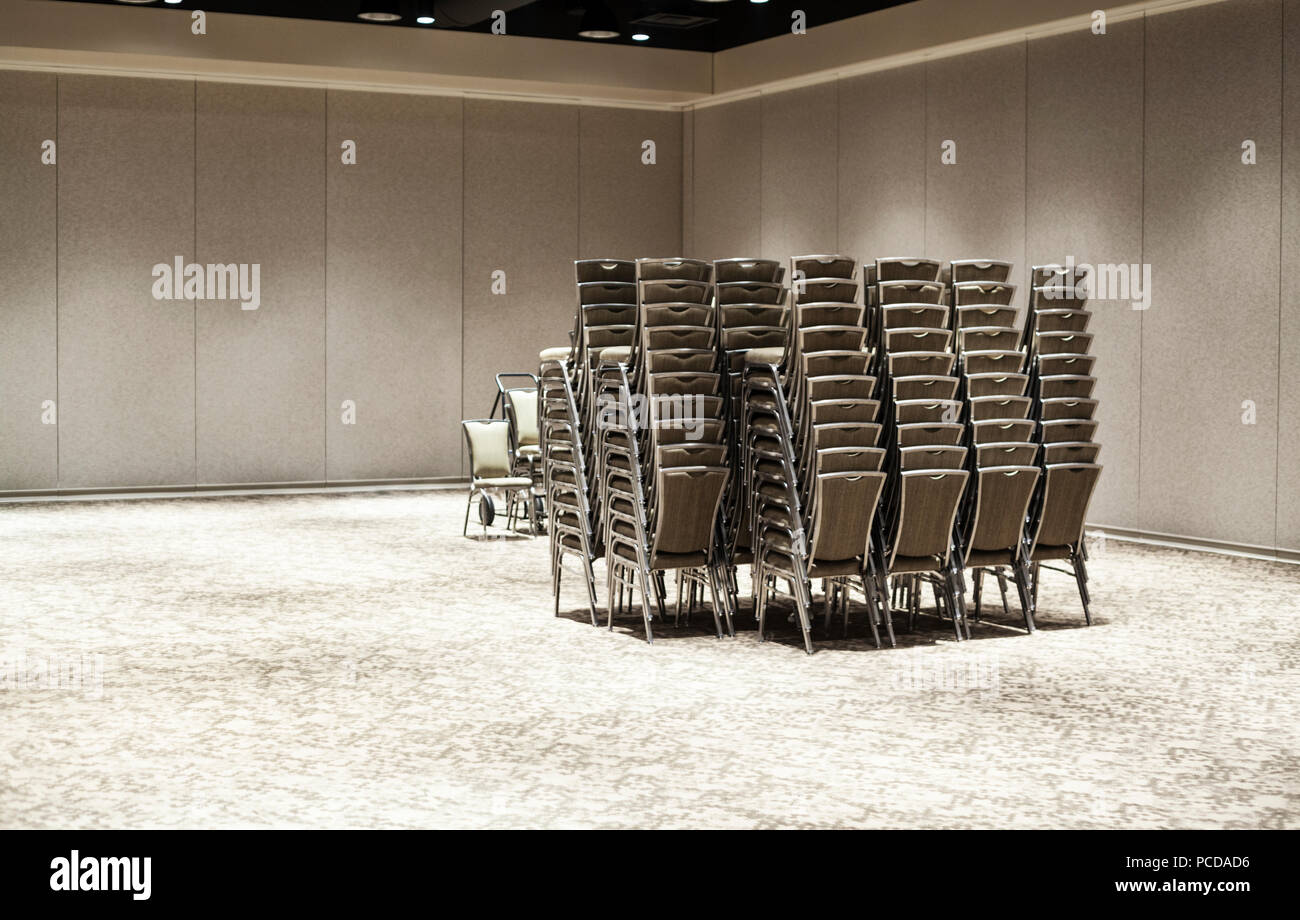 Stacked chairs in an empty convention center meeting room Stock Photo ...