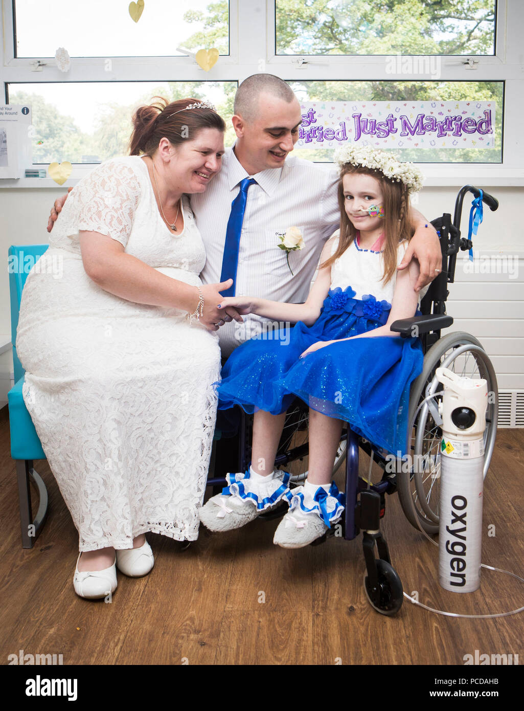 Cancer patient Kayleigh Walsh (right) with her parents Lyndsey and Paul ...