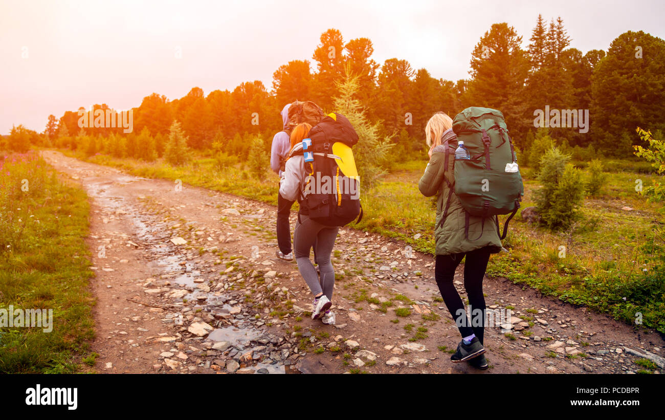 Travel Lifestyle and survival concept rear view. Two hiking women with ...