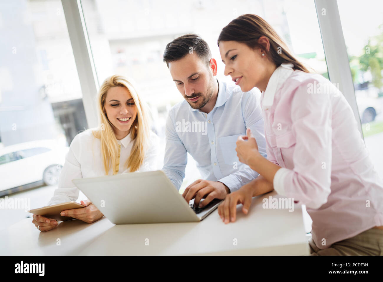Business colleagues working together at office Stock Photo - Alamy