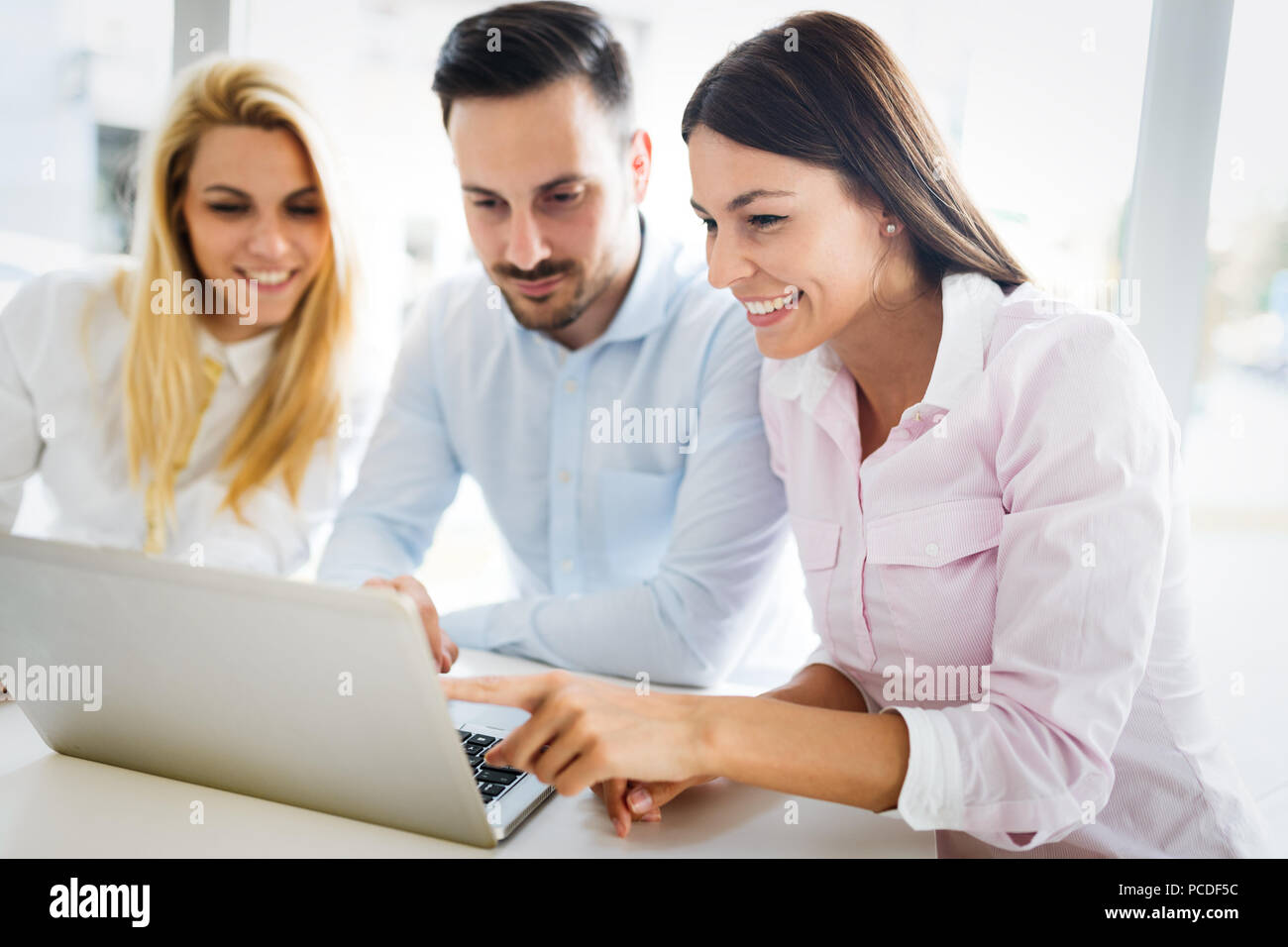 Business colleagues laughing Stock Photo - Alamy