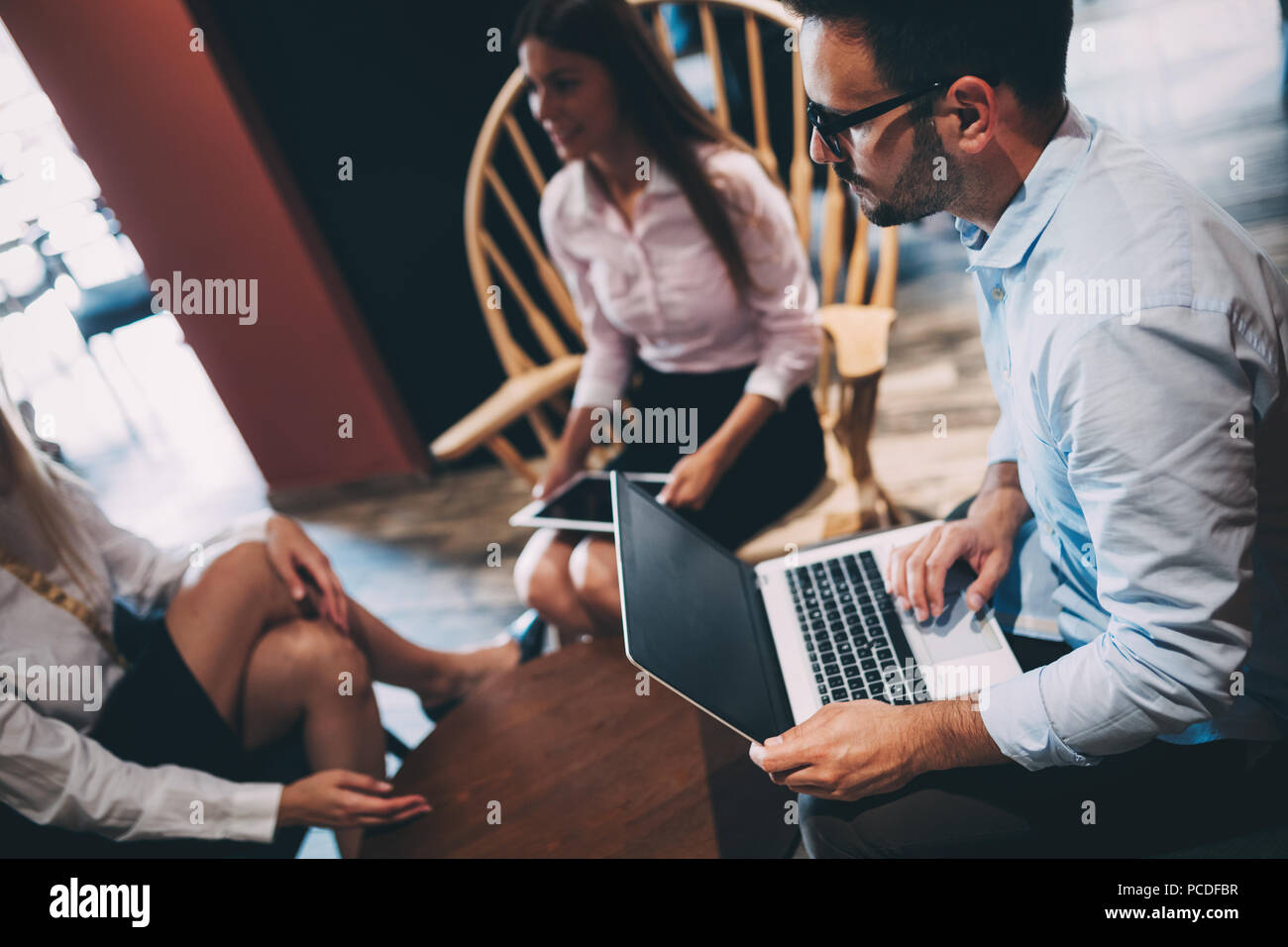 Happy colleagues from work socializing in restaurant Stock Photo - Alamy