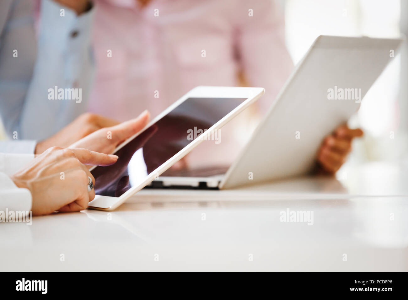 Close up picture of businessman using tablet Stock Photo - Alamy