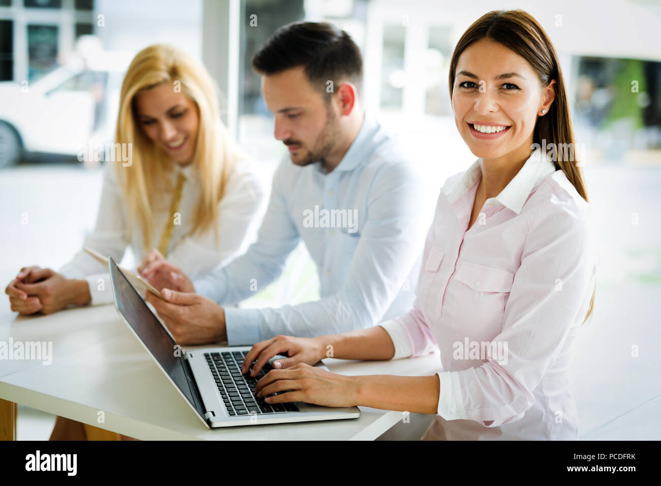 Business colleagues laughing Stock Photo - Alamy